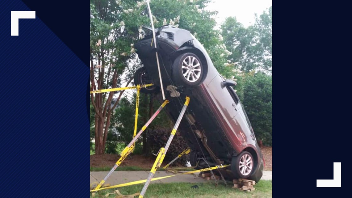 PHOTOS | High Wire Rescue: Firefighters Get Driver Out of Car Caught in ...