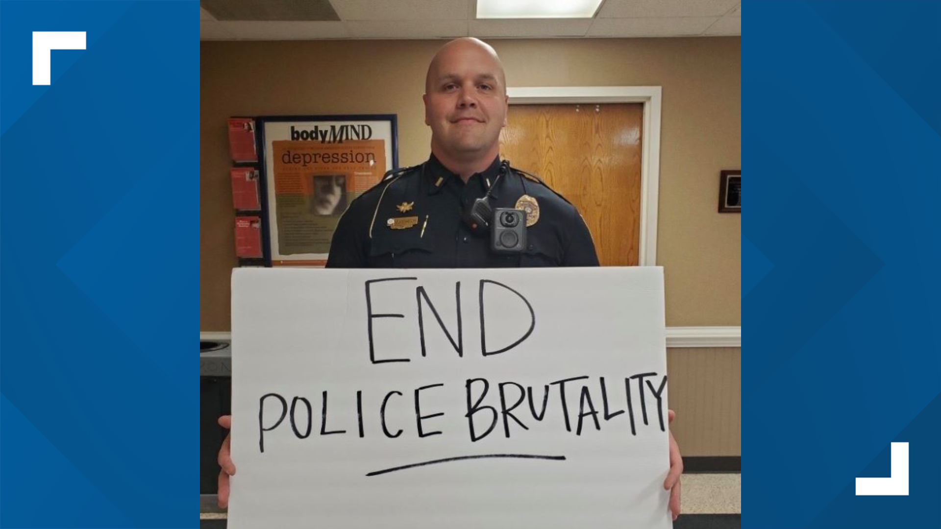 Burlington officers hold 'End Police Brutality' sign | wfmynews2.com