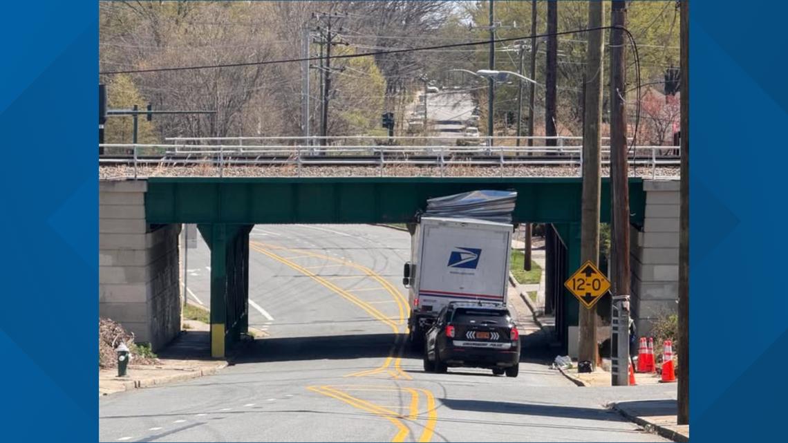 USPS truck stuck under bridge closes East Lindsay lanes | wfmynews2.com