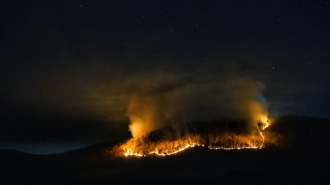 Fire crews responding to a wildfire on Pogue Mountain outside of ...