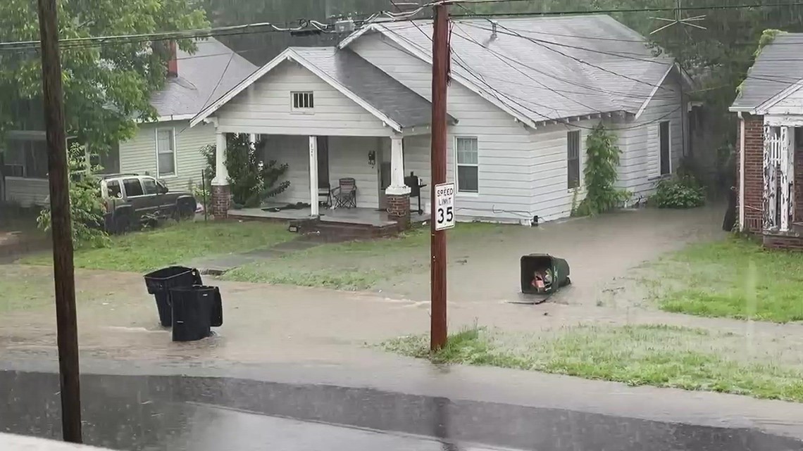 Floating trash cans washed down the road | wfmynews2.com