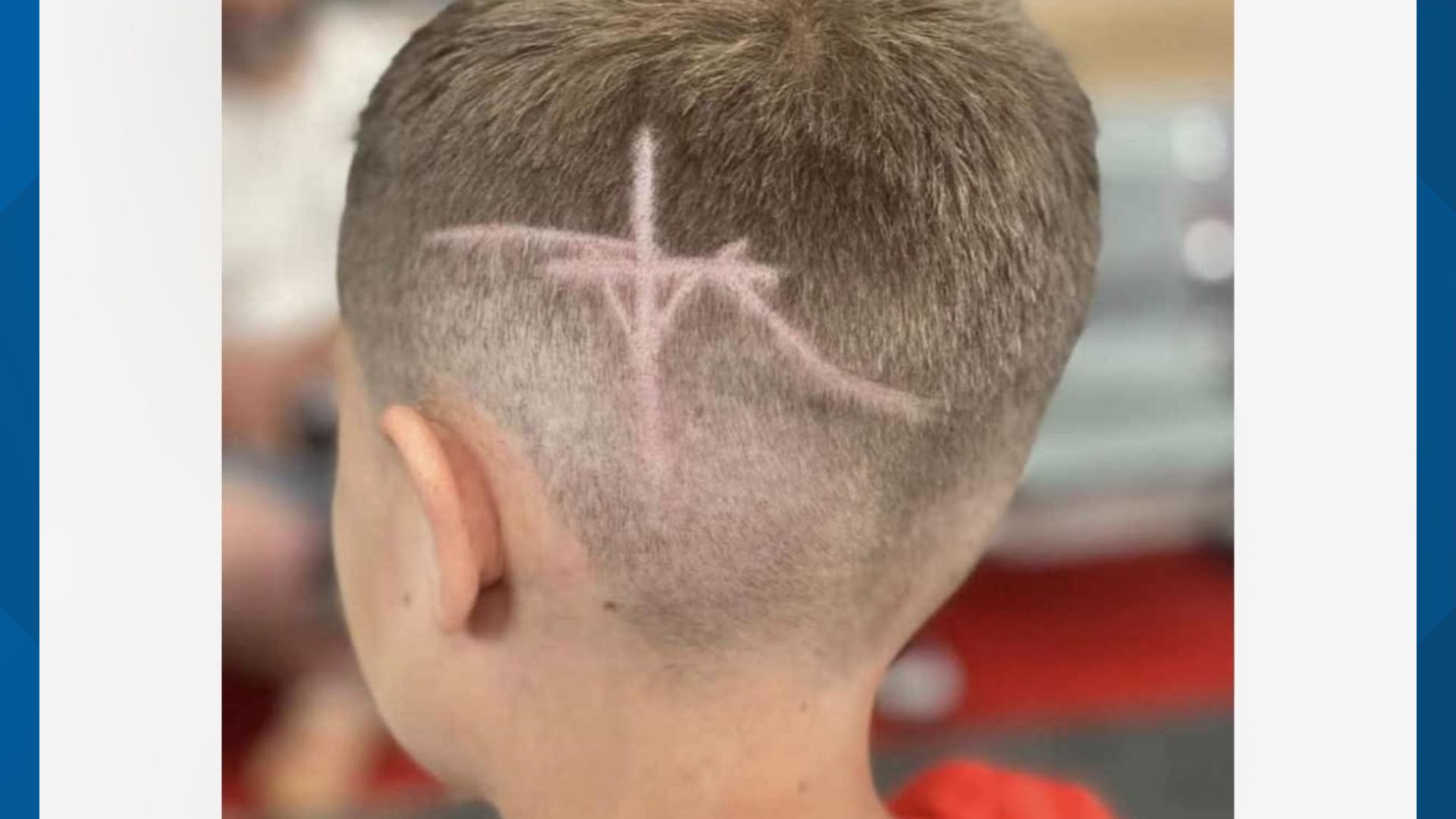 Boy honors godfather killed in Eden crash with unique haircut ...