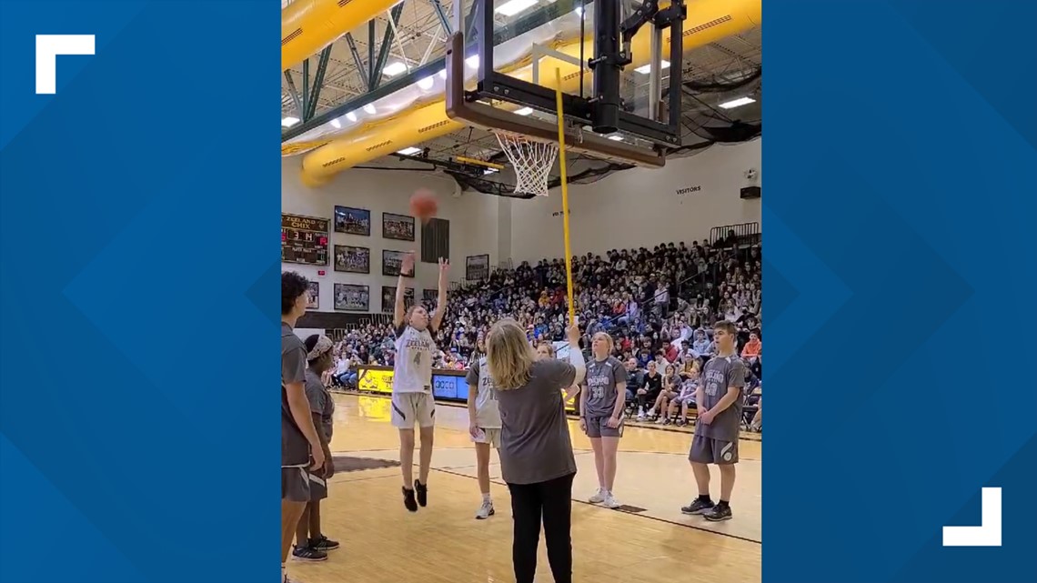 Zeeland basketball player who is blind sinks shot in packed gym ...